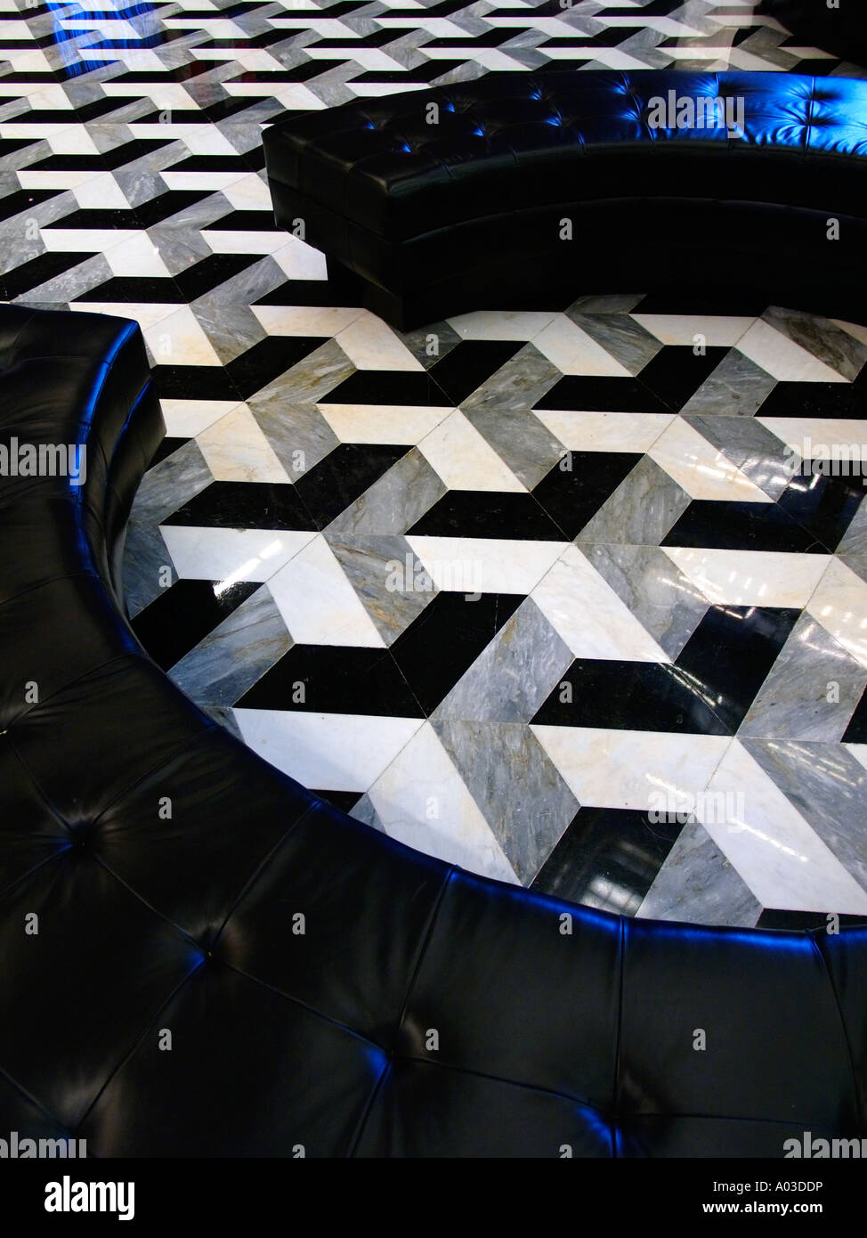 Patterned marble floor and circular benches inside the foyer of the ...