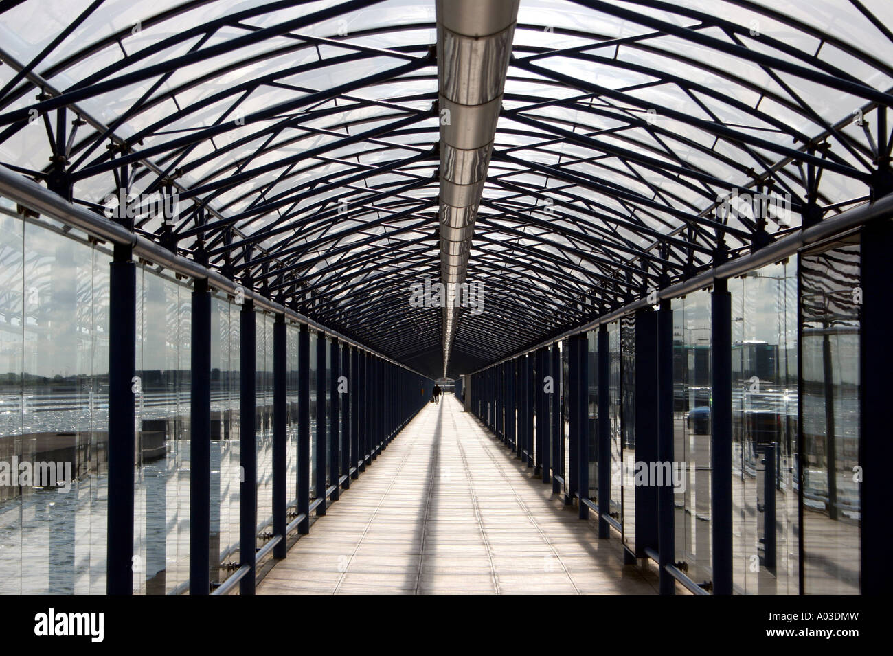 Covered glass walkway Stock Photo - Alamy