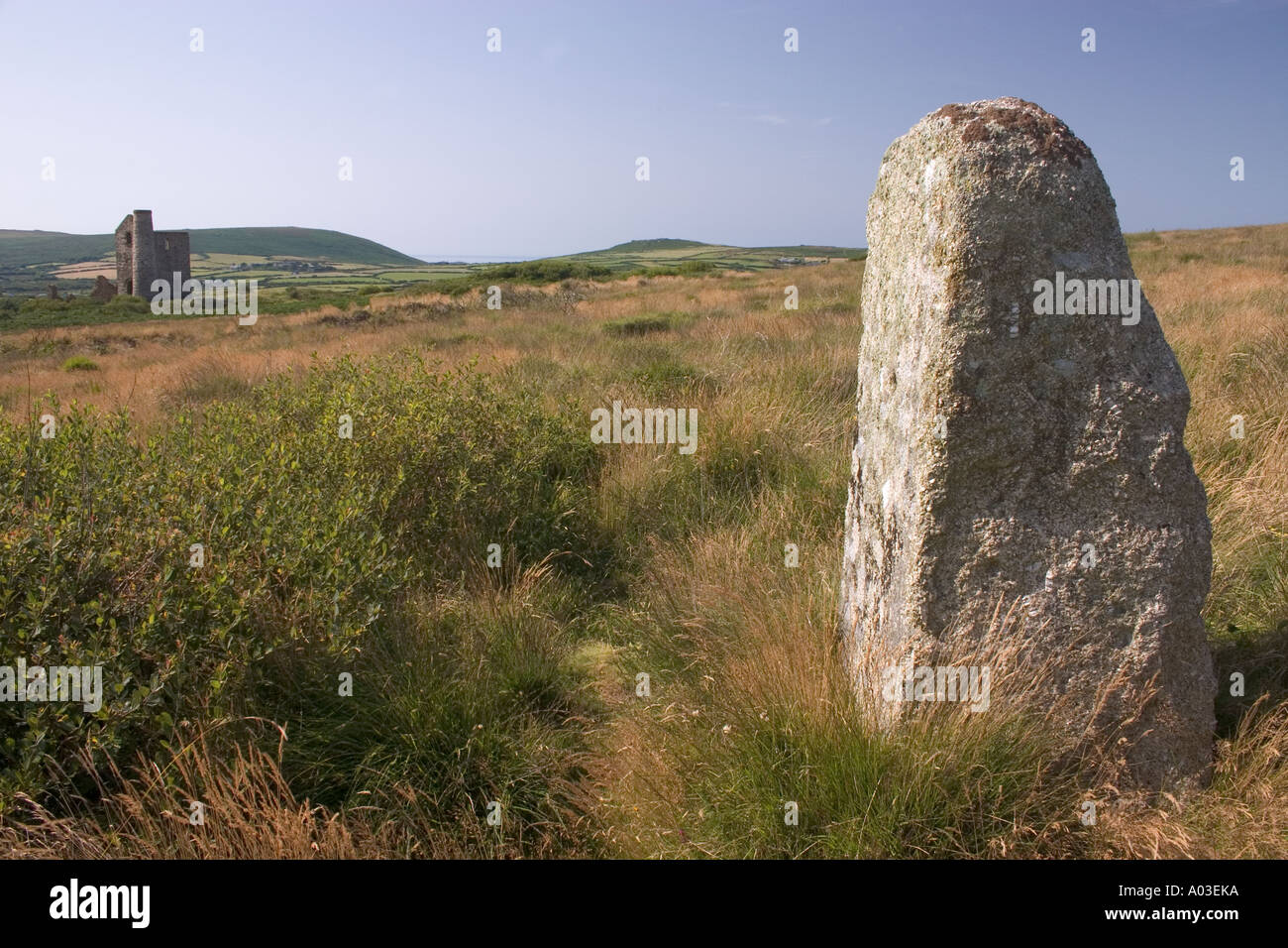 Standing Stone with Cornish Tin Mine Stock Photo - Alamy