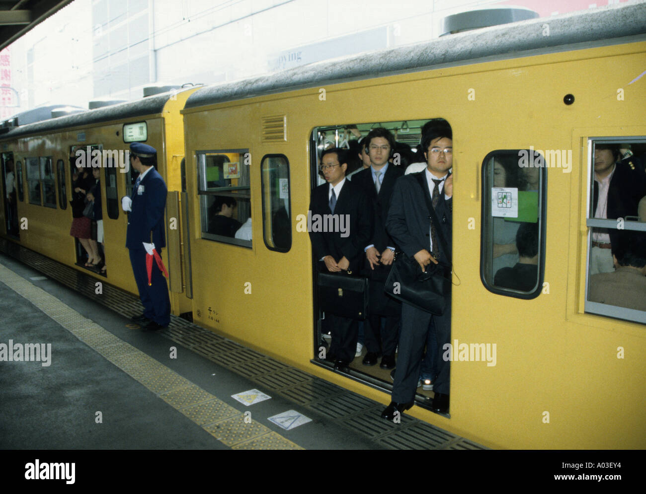 Metro Train packed with commuters Tokyo Japan Stock Photo - Alamy