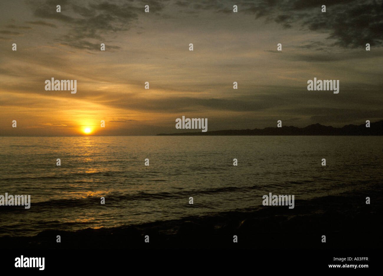 Stock image of sunset over the Pacific Ocean at Zipolite Oaxaca Mexico ...