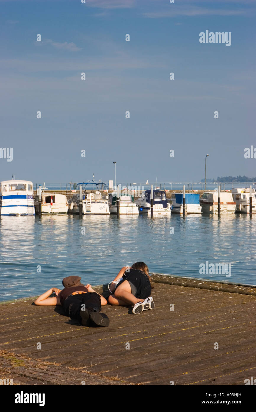 Two young women relaxing in the harbour Konstanz Bodensee Lake ...