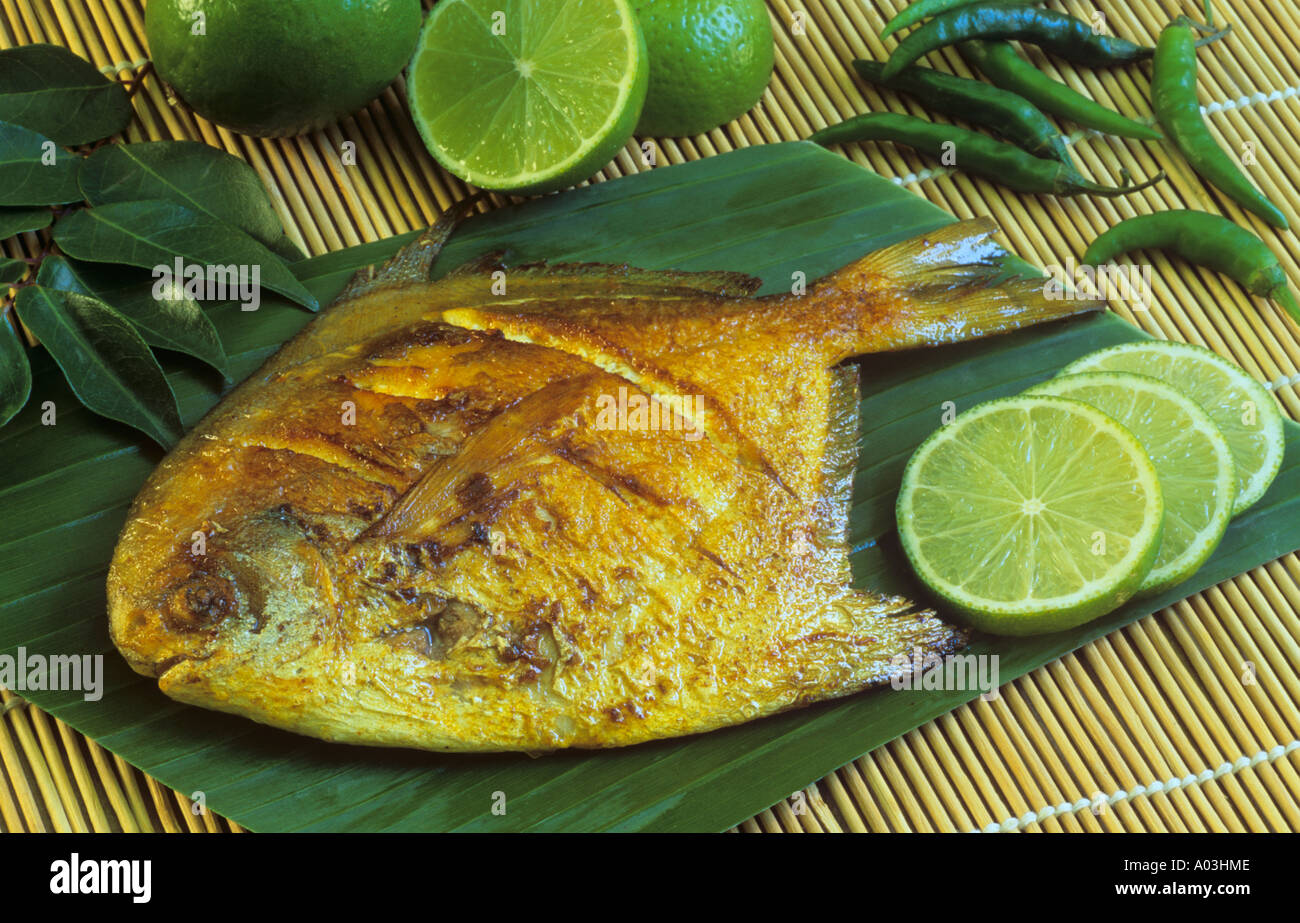 Pomfret fish on banana leaf South India Stock Photo - Alamy