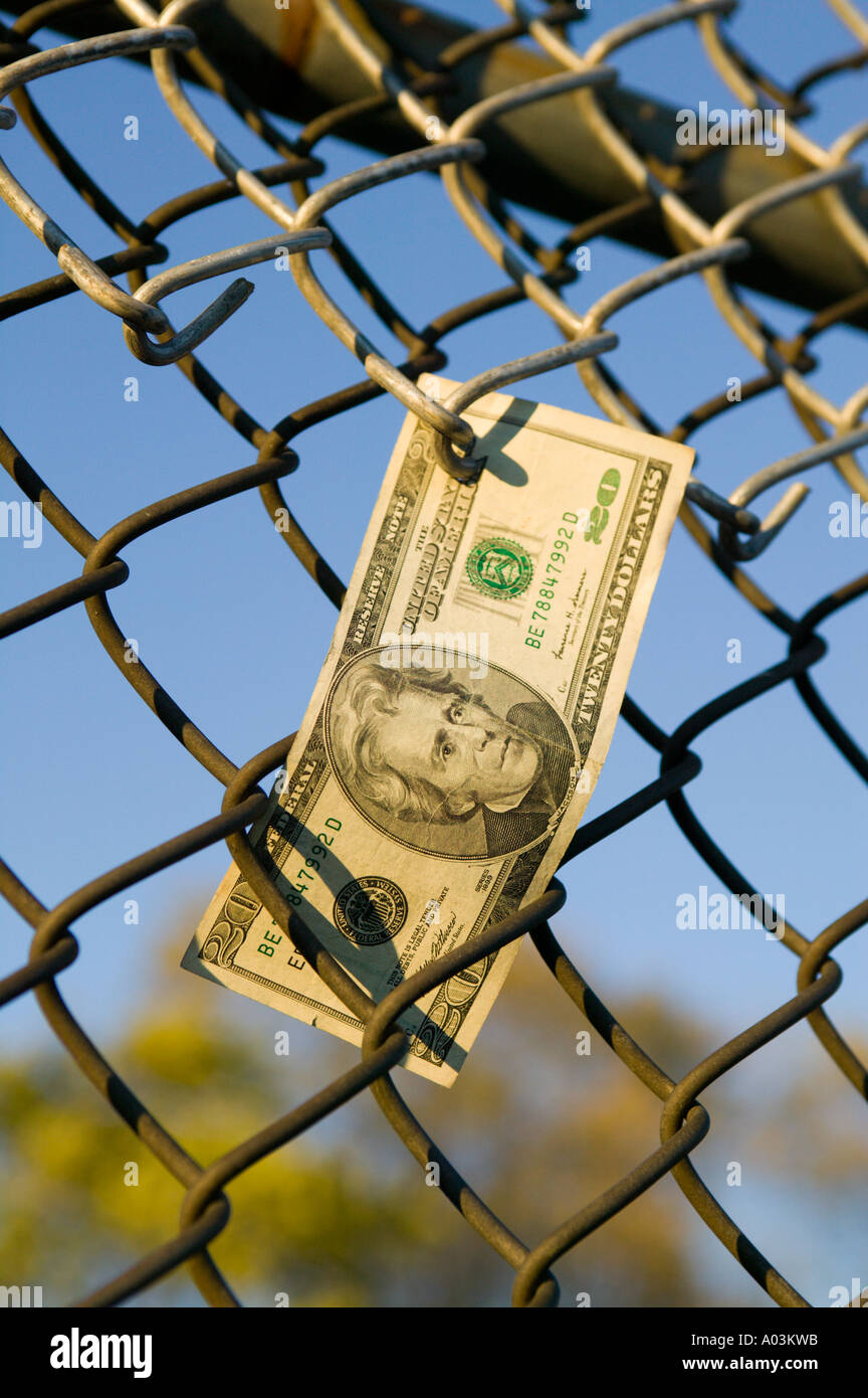 Money Stuck in Fence Stock Photo - Alamy