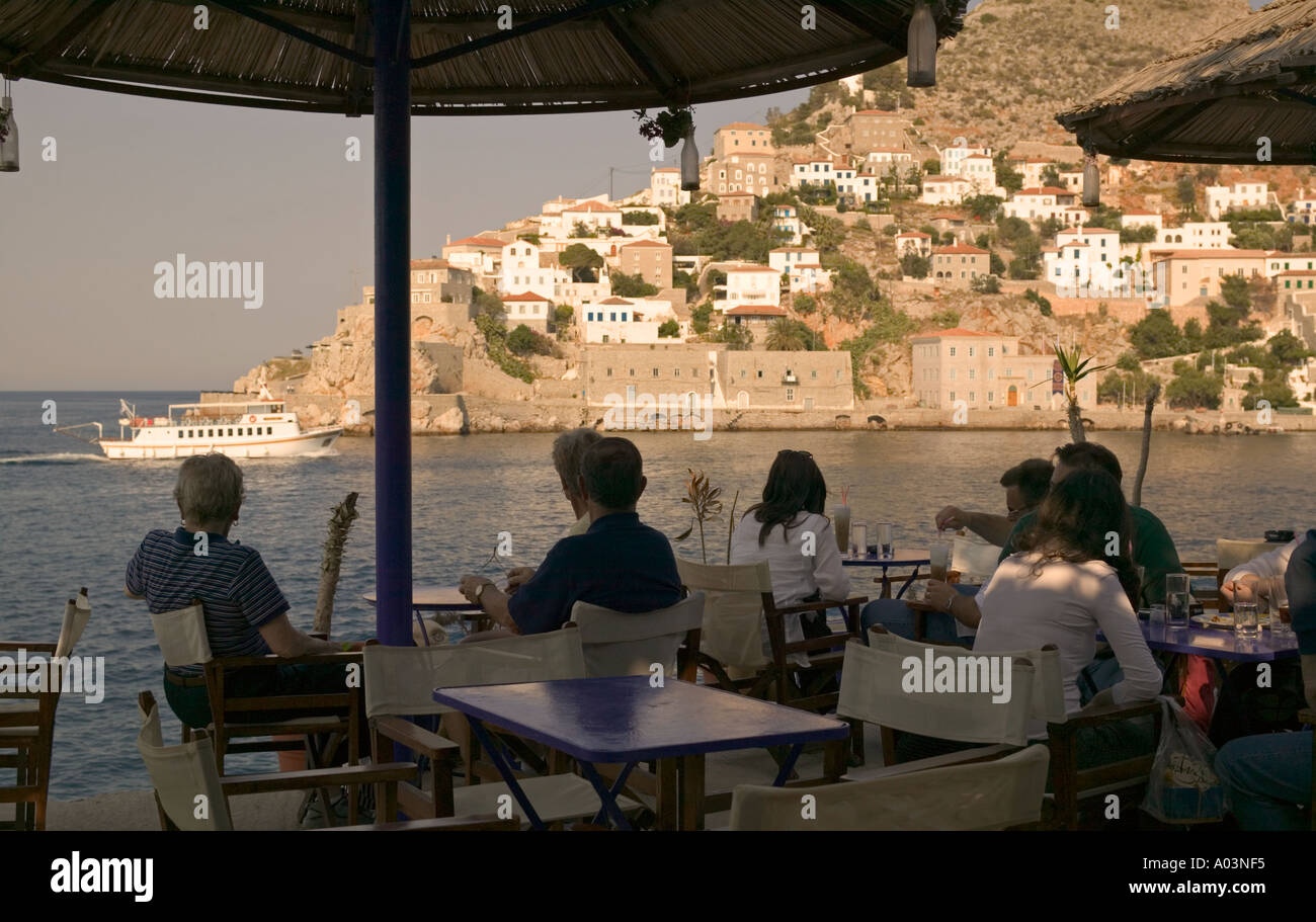 A cafe over looking the entrance to the port in Hydra Town, Hydra Stock ...