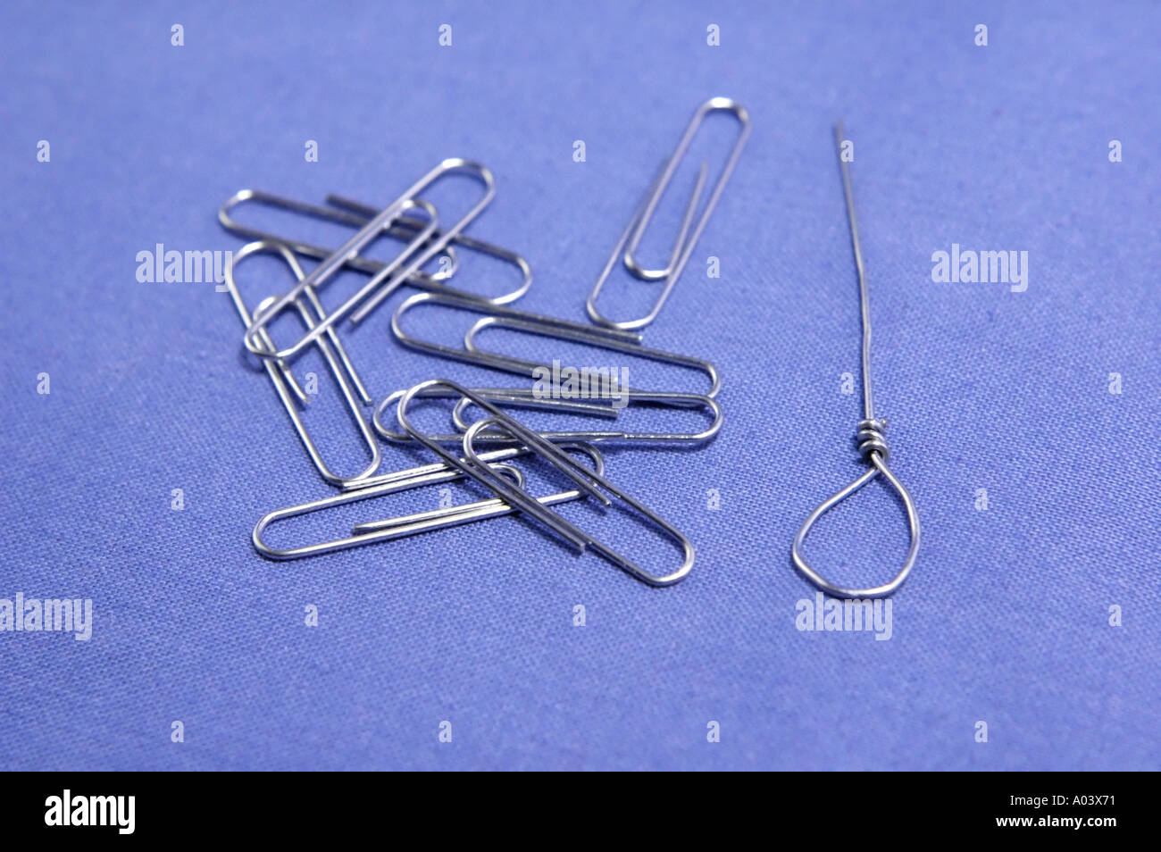 Pile of wire paper clips with one bent in the form of a noose Stock ...