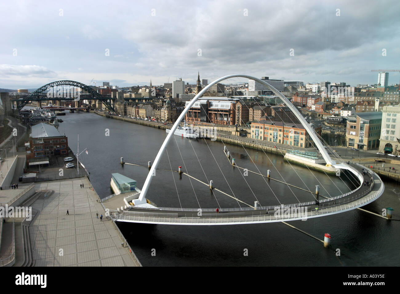 The Millennium Eye bridge over the River Tyne with the Tyne bridge ...