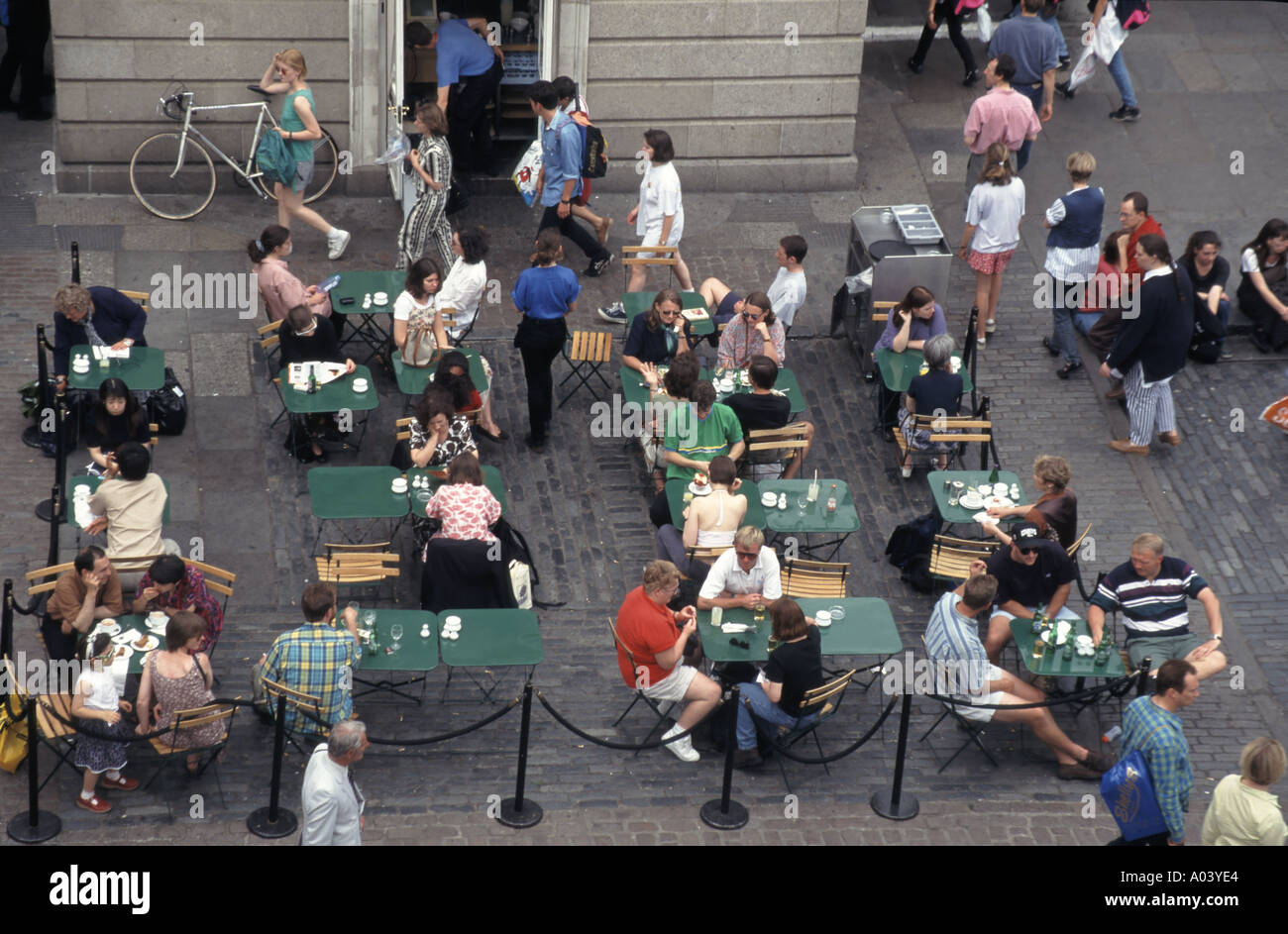 Aerial view of tourism people sitting down at outdoor café bar tables ...