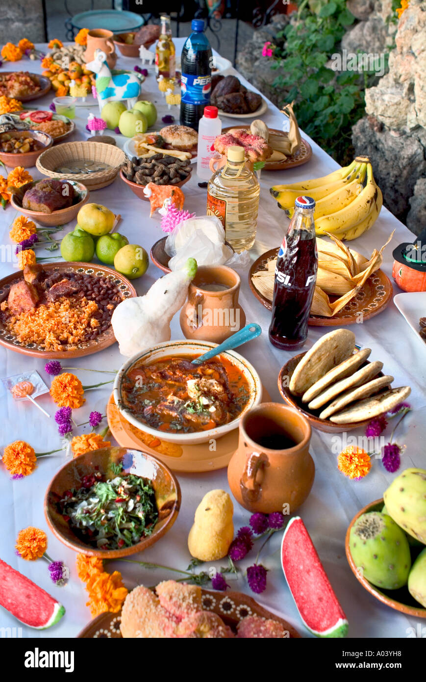 Day of the Dead display of offerings including food drink marigolds and ...