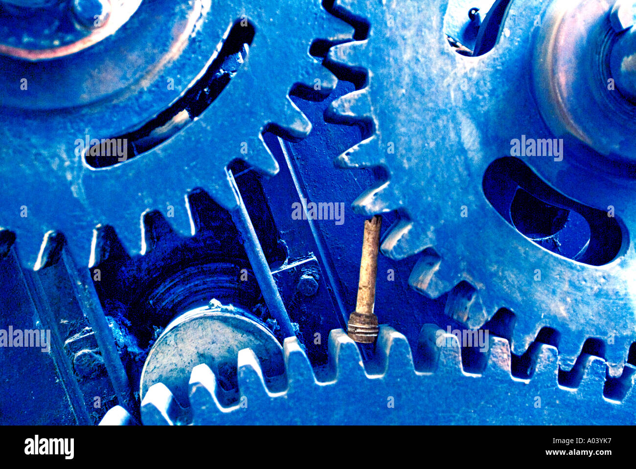 Computer enhanced image of large metal industrial gears in blue Stock ...