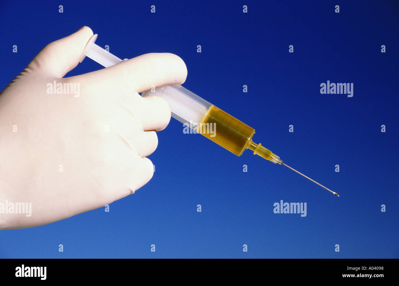 Hand with injection Stock Photo - Alamy