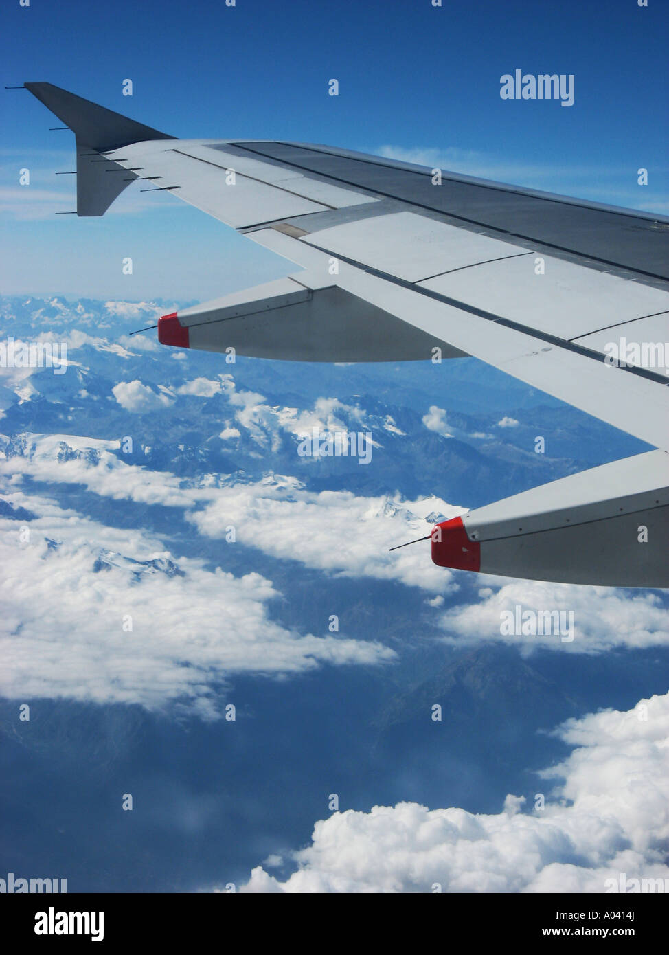View from passenger jet window flying at 35 000 feet over Swiss Alps ...