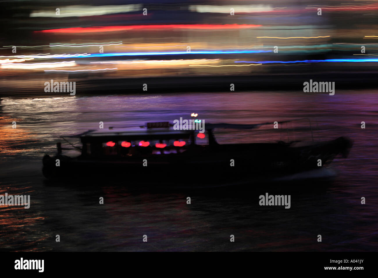 Asia Singapore Blurred image of tourists bum boat motoring down ...