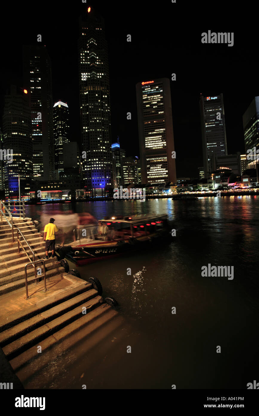 Asia Singapore Tourists bum boat pulls up to dock steps along Singapore ...