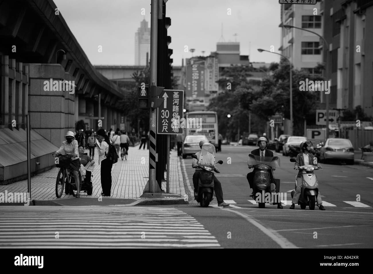 Taiwan Taipei Motorcycle traffic along downtown city street Stock Photo ...