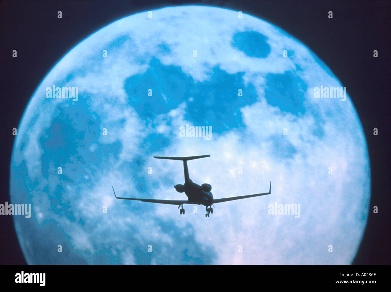 Small Jet Plane silhouette on Moon Stock Photo - Alamy