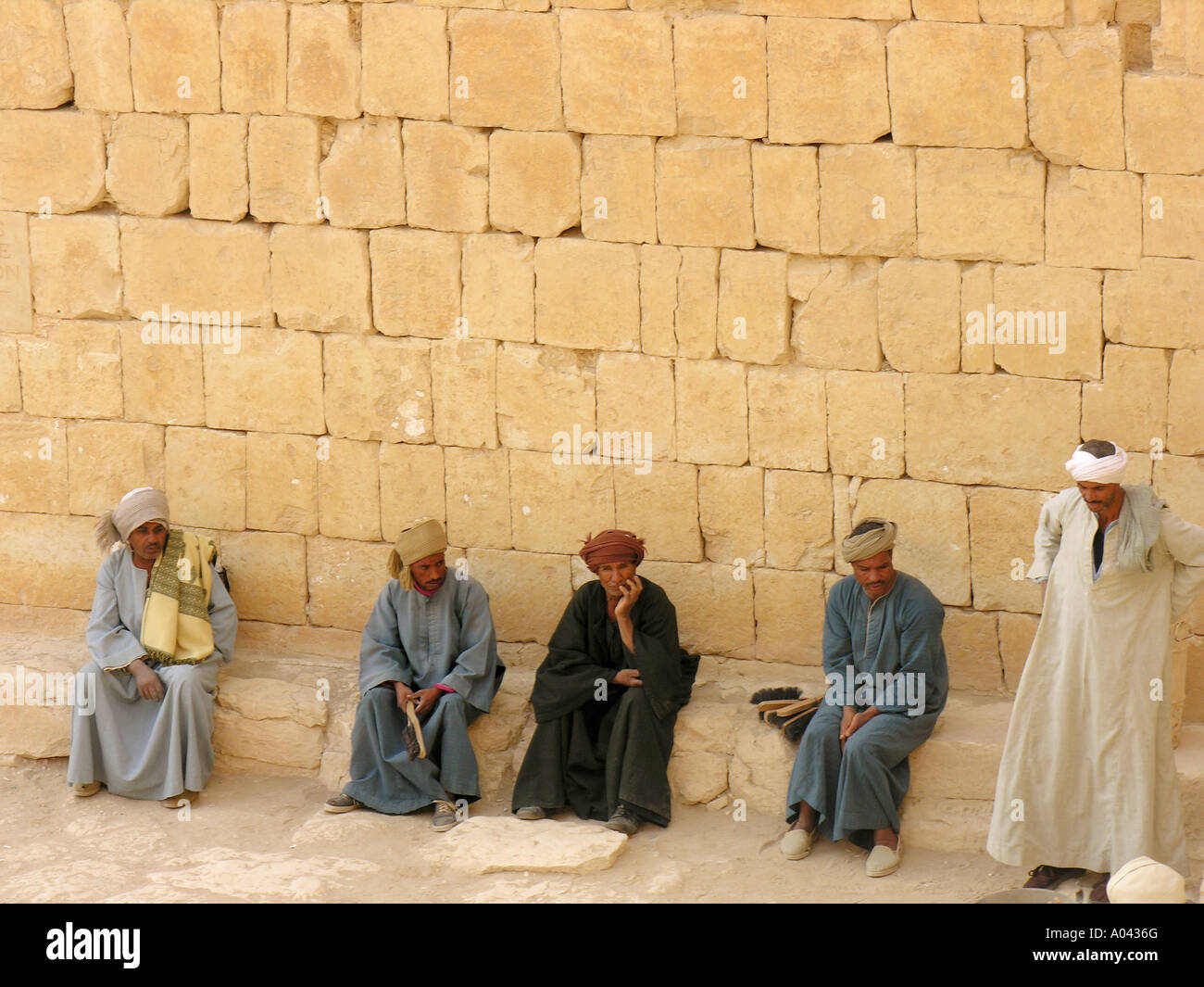 Egypt temple men sitting around Stock Photo - Alamy