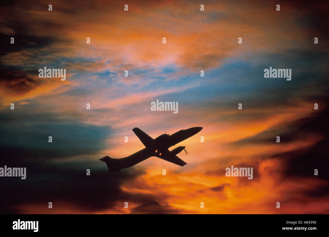 Airplane at sunset Stock Photo - Alamy