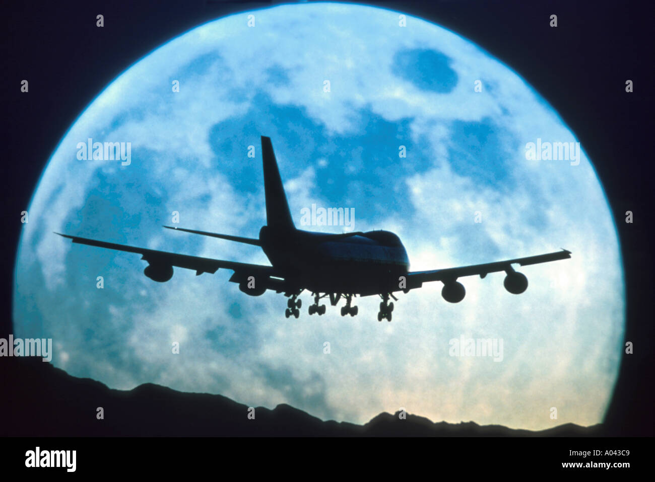 Airplane in front of Moon Stock Photo - Alamy
