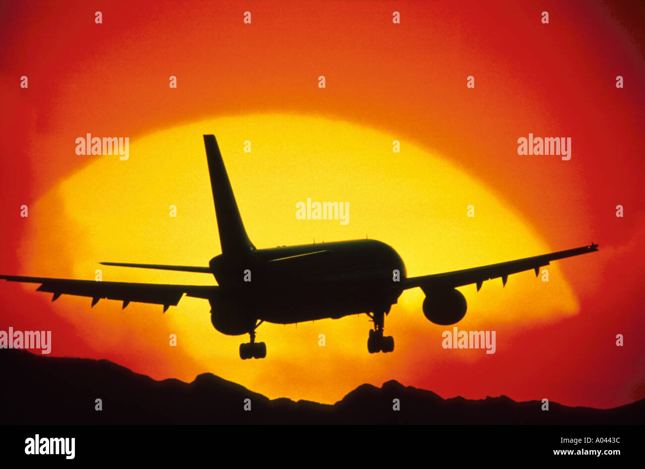 Airplane in front of Giant Sun Stock Photo - Alamy