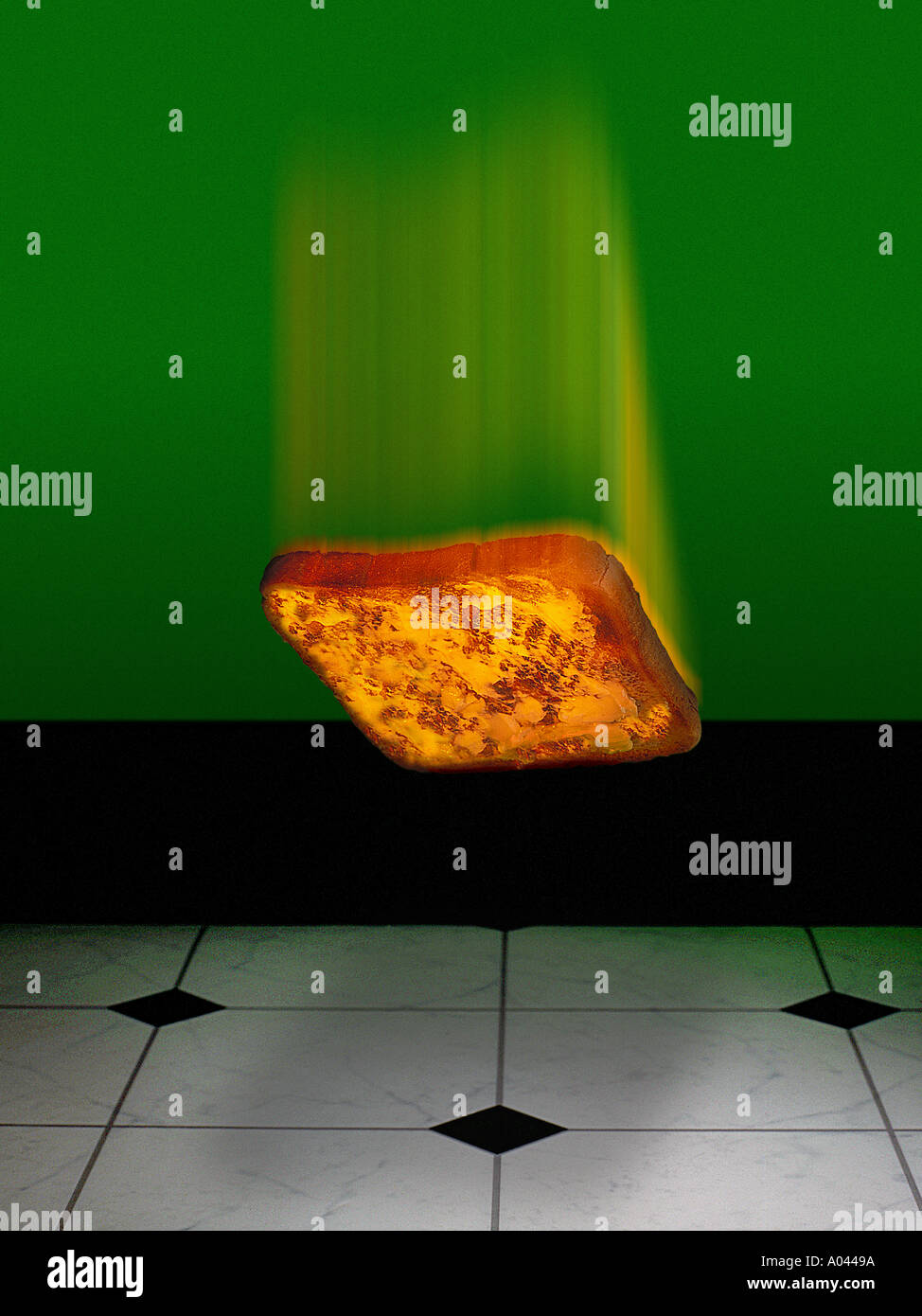 Toast about to land buttered side down on floor Stock Photo - Alamy