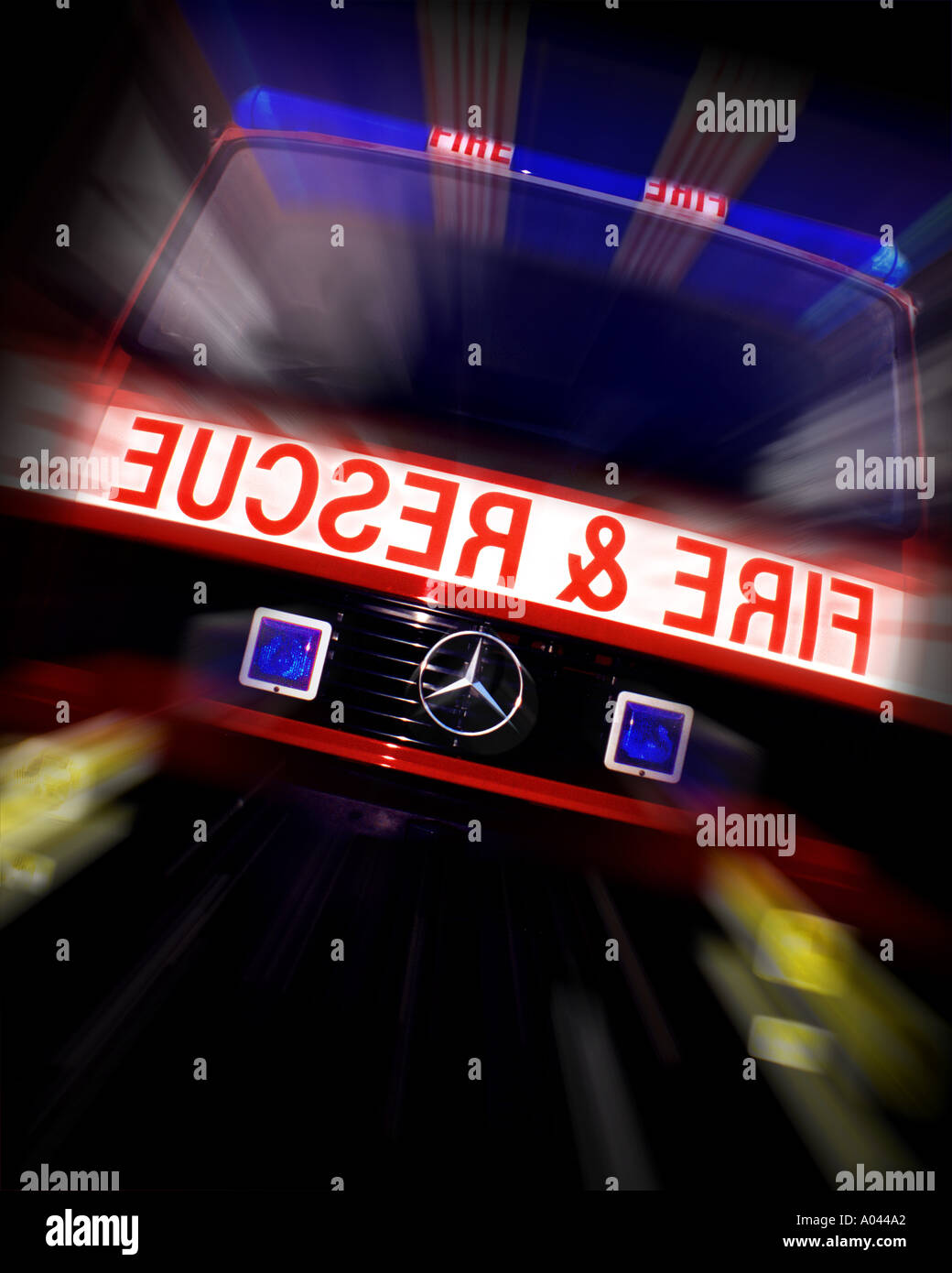 Front view of speeding fire engine with blue lights flashing Stock ...