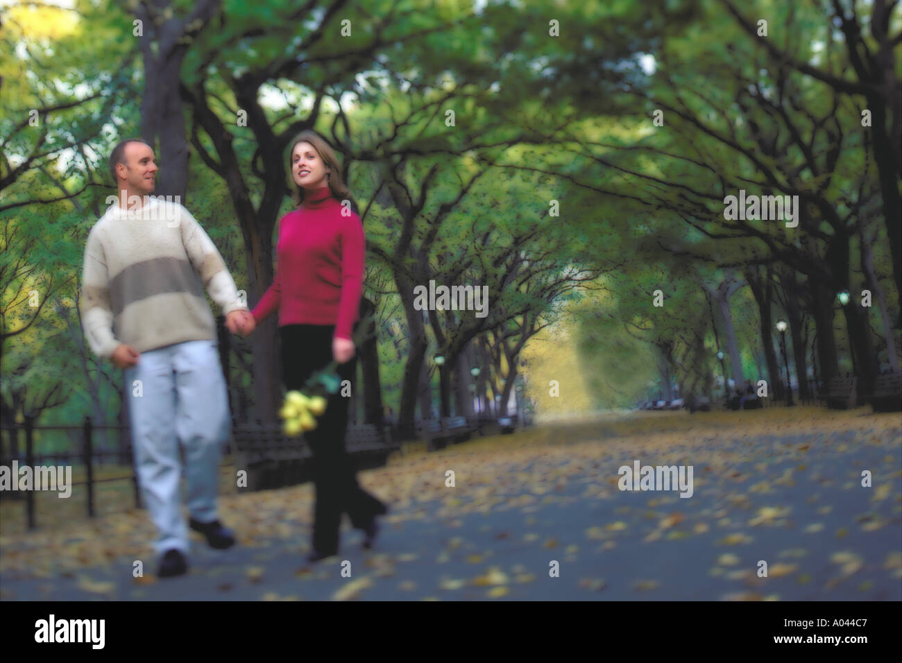 Romantic couple walking in park Stock Photo - Alamy