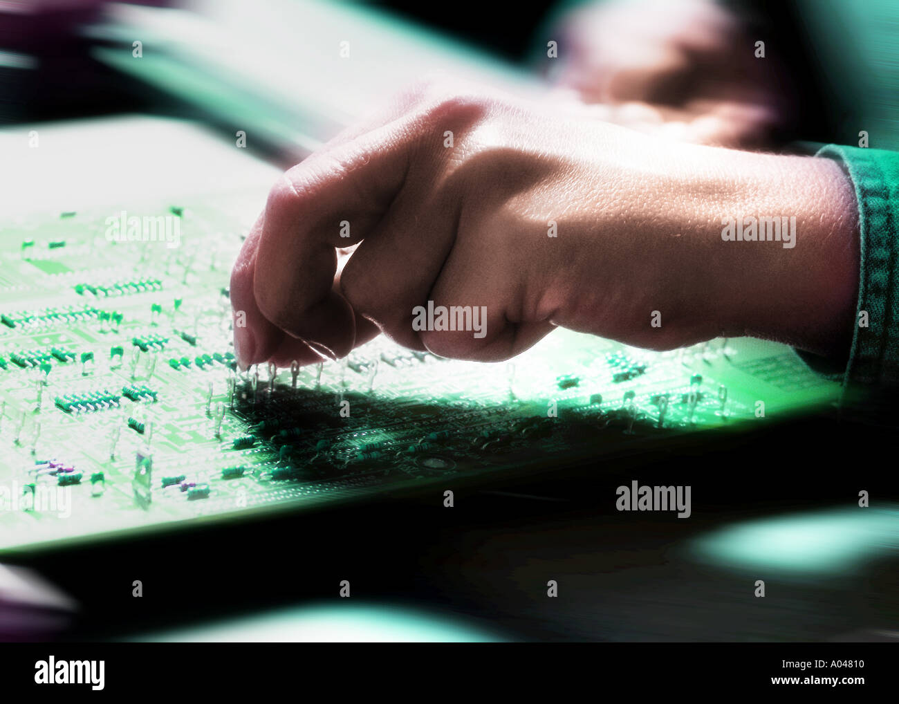 Hand with electronic piece Stock Photo - Alamy
