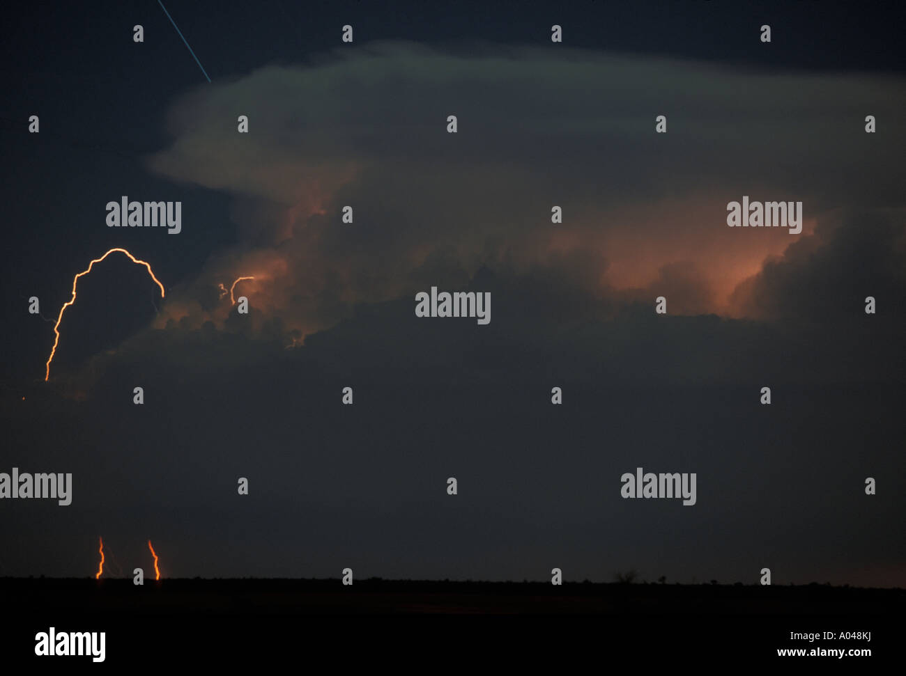 Botswana, Nxai Pan National Park, Lightning strikes from storm cloud at ...