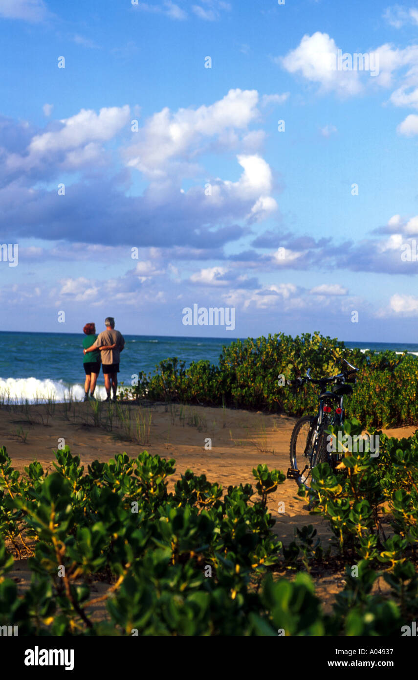 Cycling couple at beach in Puerto Rico Stock Photo - Alamy