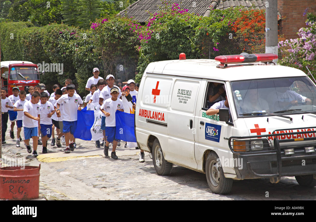 GUATEMALA Panajachel Guatemalan school children run behind a flaming ...