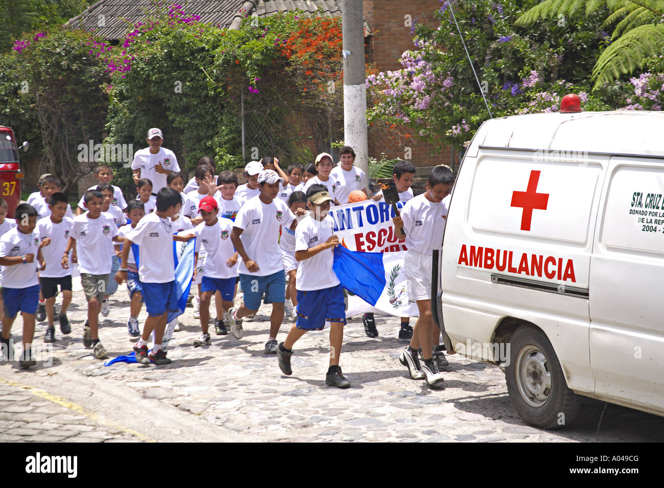 GUATEMALA Panajachel Guatemalan school children run behind a flaming ...