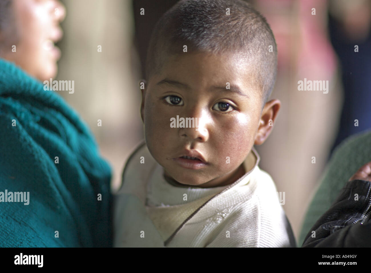 GUATEMALA CAPELLANIA Young indigenous Maya Quiche boy waiting to be ...