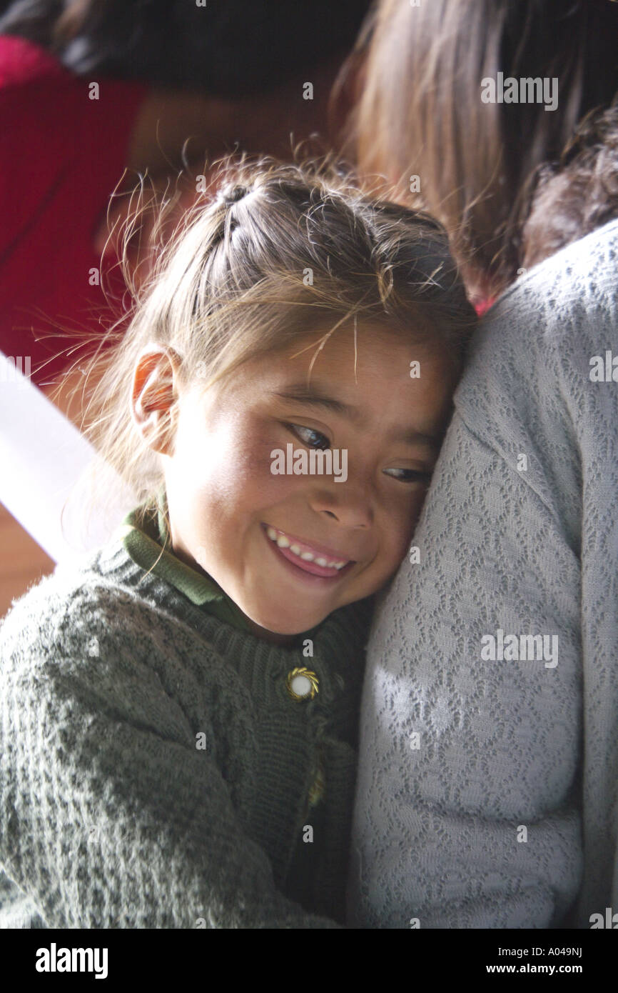 GUATEMALA CAPELLANIA Smiling young indigenous Maya Quiche girl waiting ...