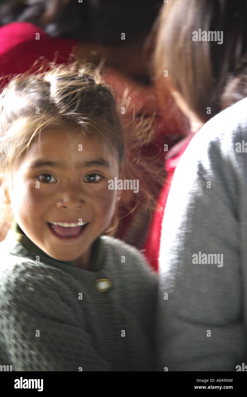 GUATEMALA CAPELLANIA Happy young indigenous Maya Quiche girl waiting to ...