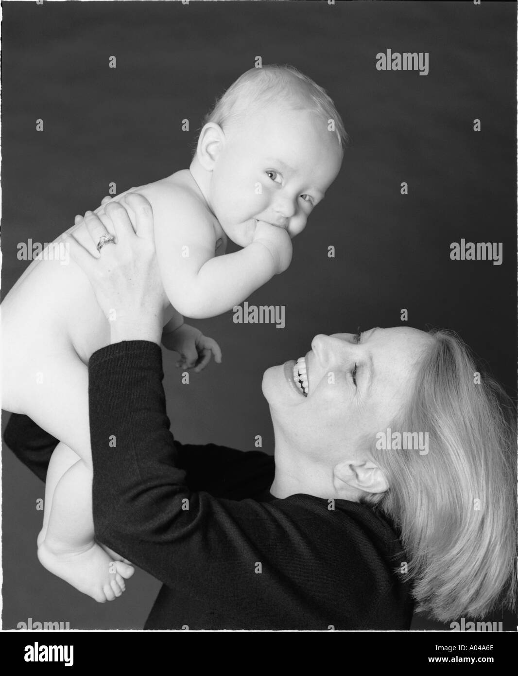 Mother nurturing Black and White Stock Photos & Images - Alamy