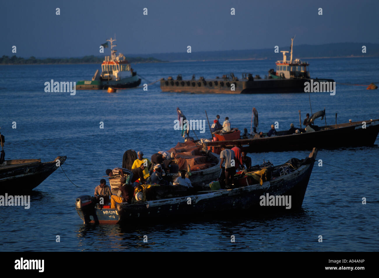 Africa Tanzania Zanzibar Stone Town Crowded fishing boats sail and ...