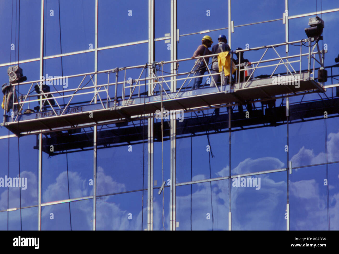 Cleaning high rise windows Stock Photo - Alamy