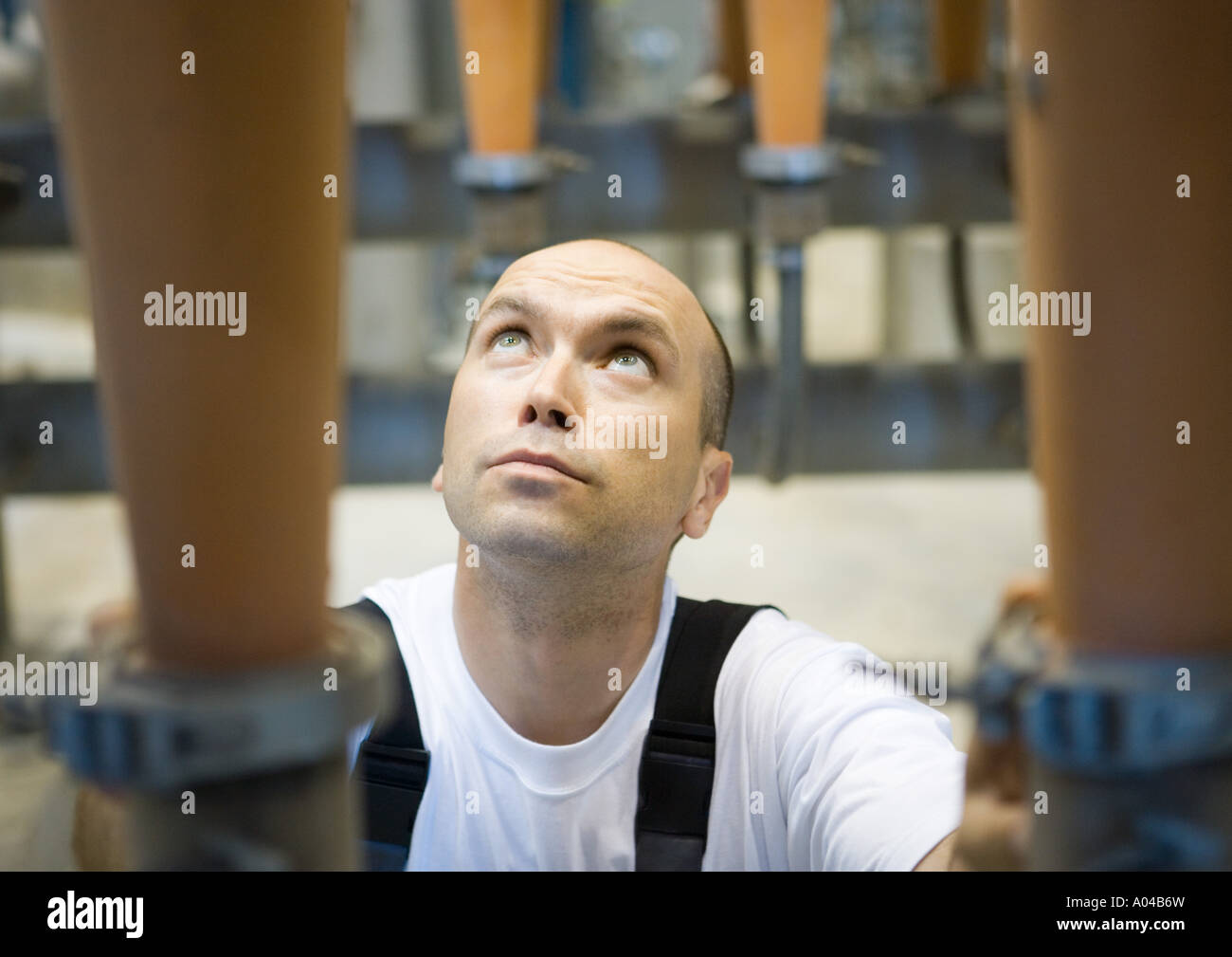 Factory worker, looking up Stock Photo - Alamy