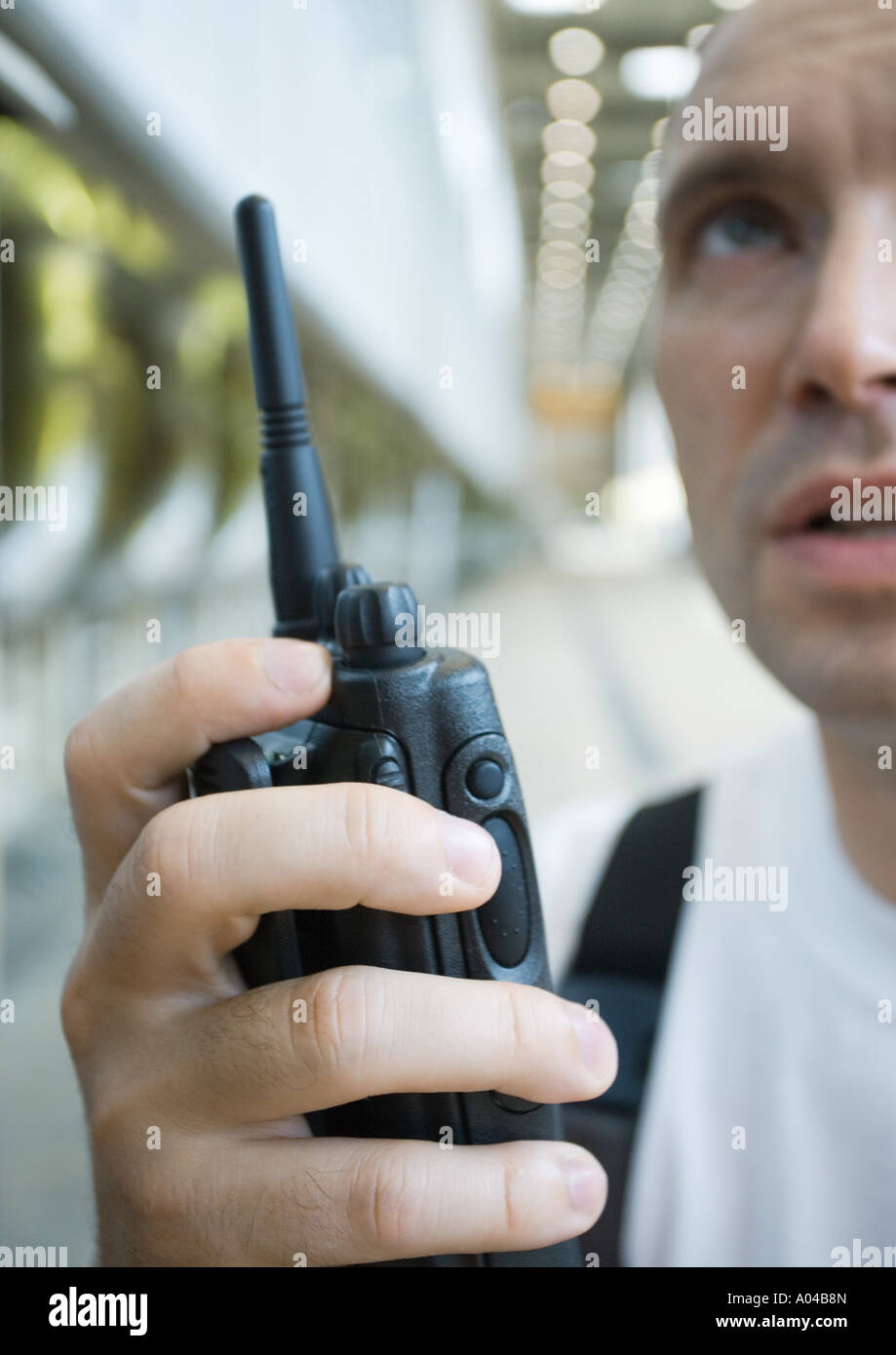 Factory worker using walkie talkie Stock Photo - Alamy