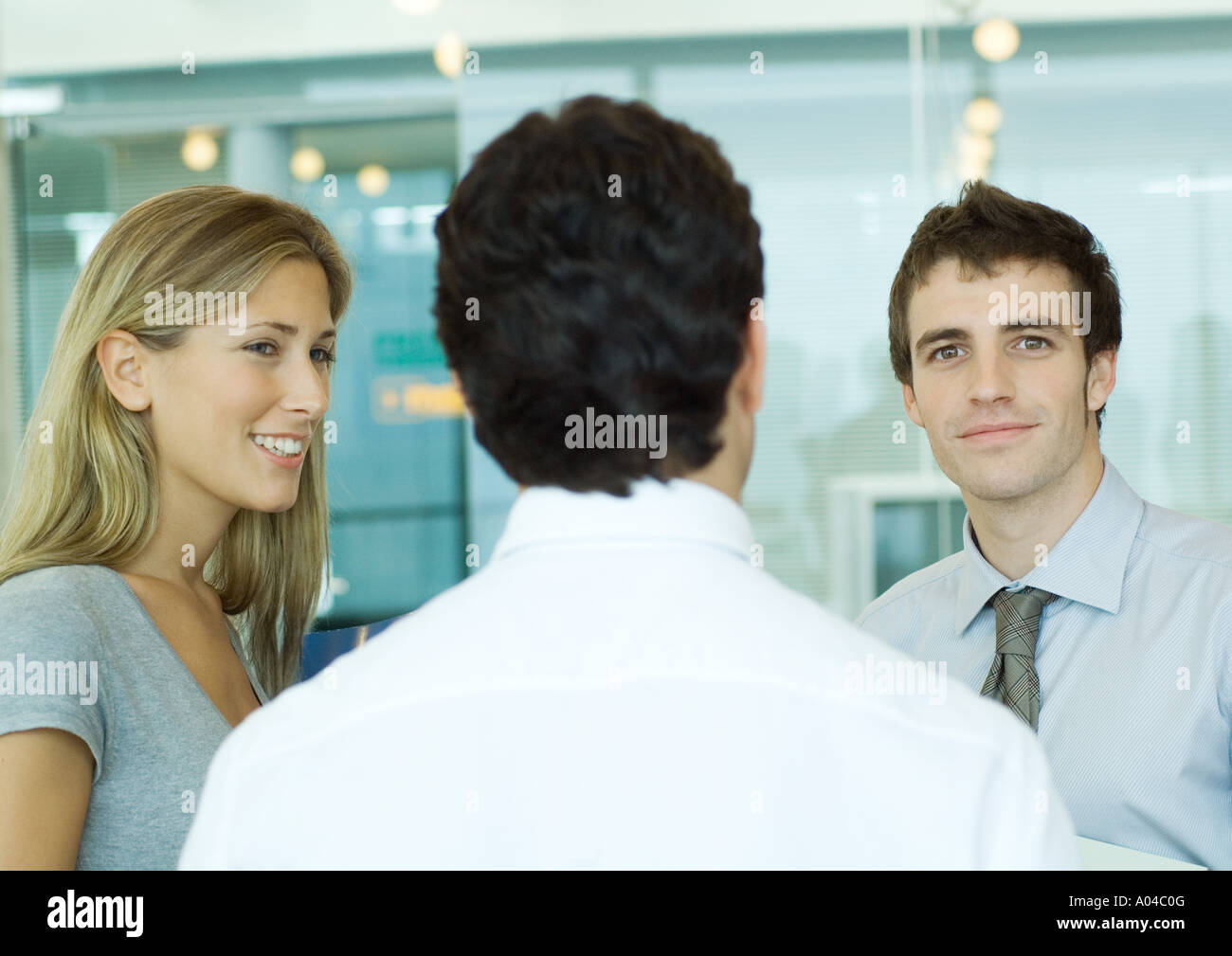 Young executives talking Stock Photo - Alamy