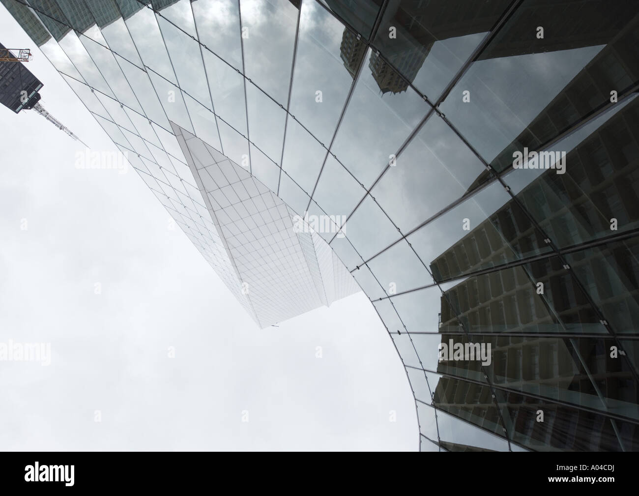 Skyscraper with reflection of buildings on facade, low angle, abstract ...