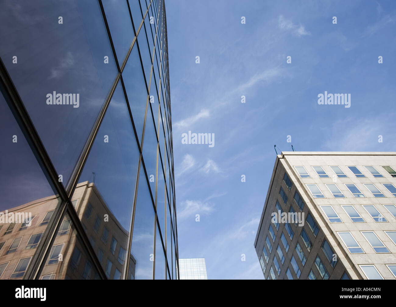 Building reflected on skycraper windows, low angle view Stock Photo - Alamy