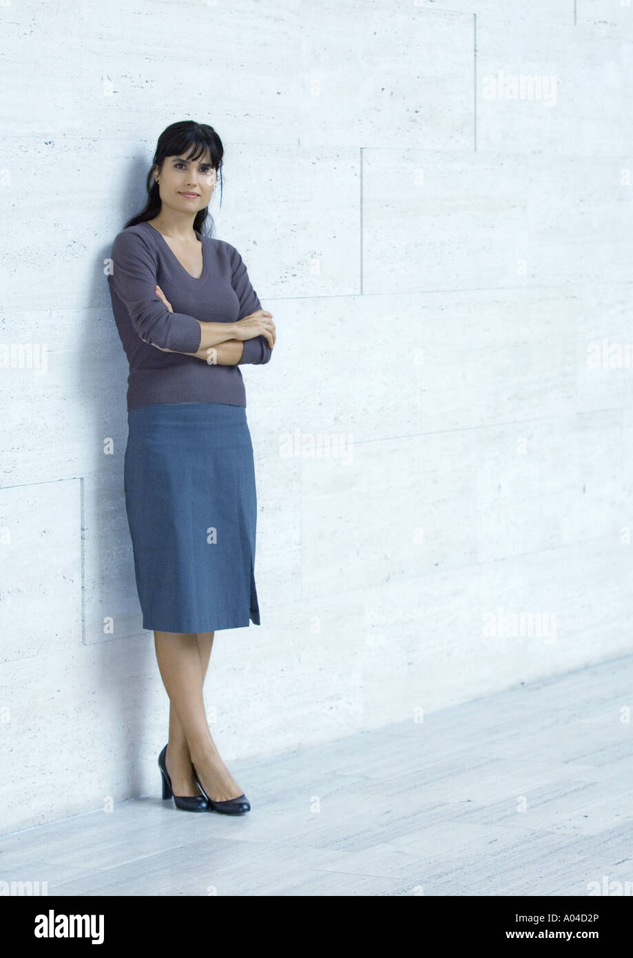 Legs girl leaning against wall hi-res stock photography and images - Alamy