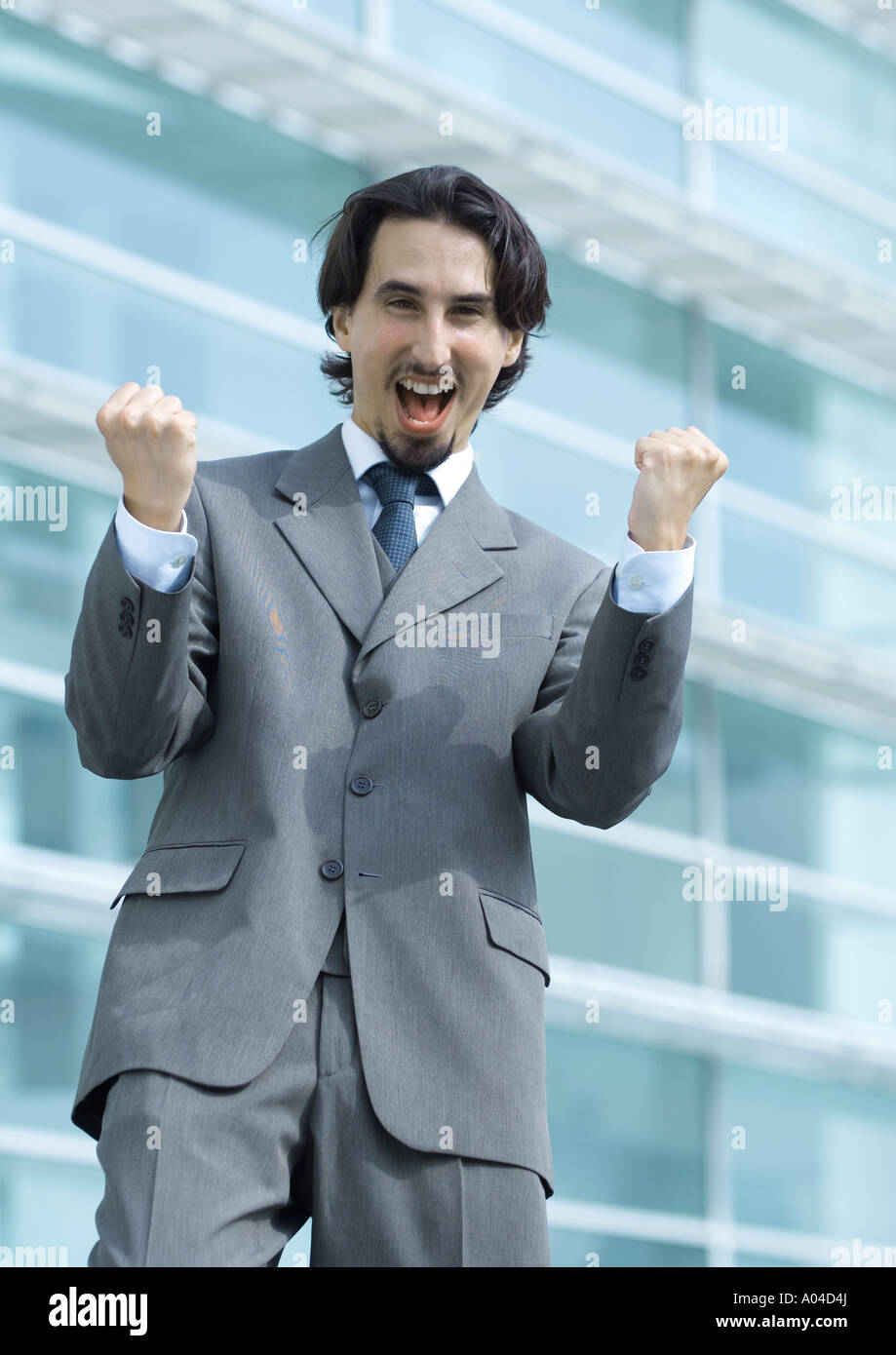 Business man shouting and making fists Stock Photo - Alamy