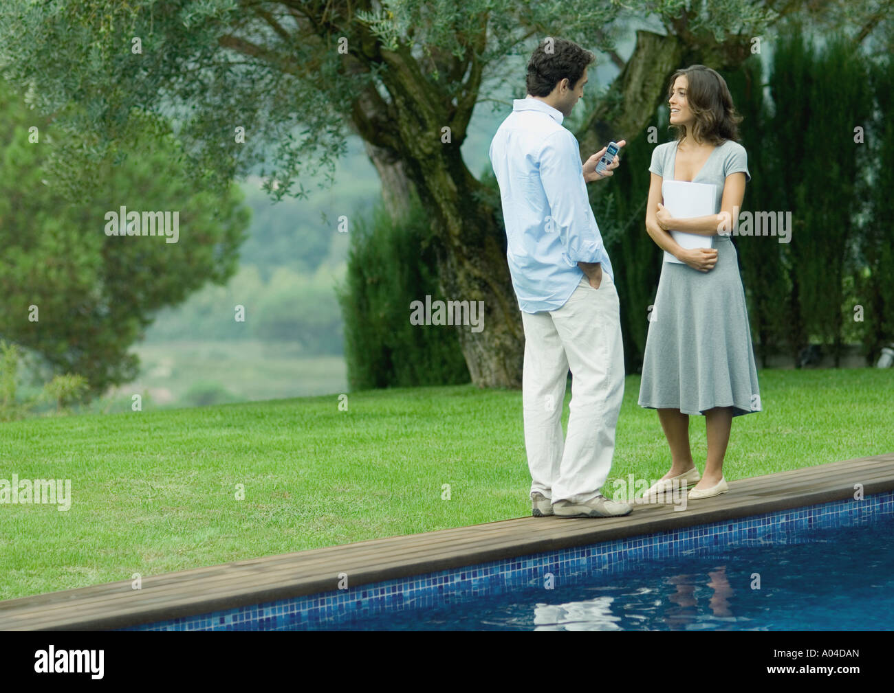 Man standing near swimming pool hi-res stock photography and images - Alamy
