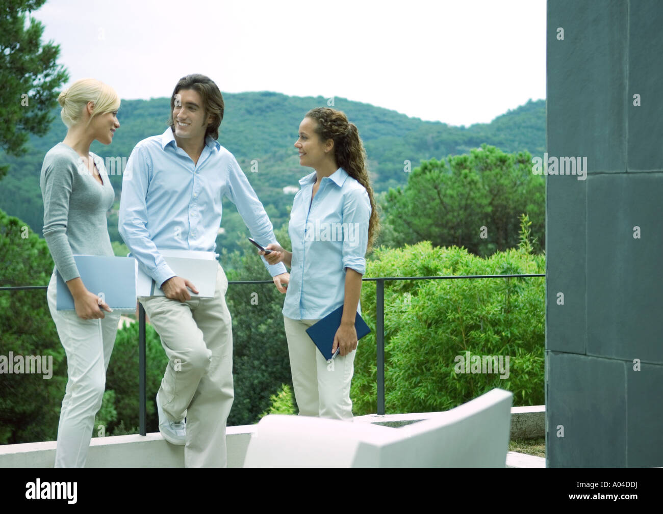 Casually dressed young executives working outdoors Stock Photo - Alamy