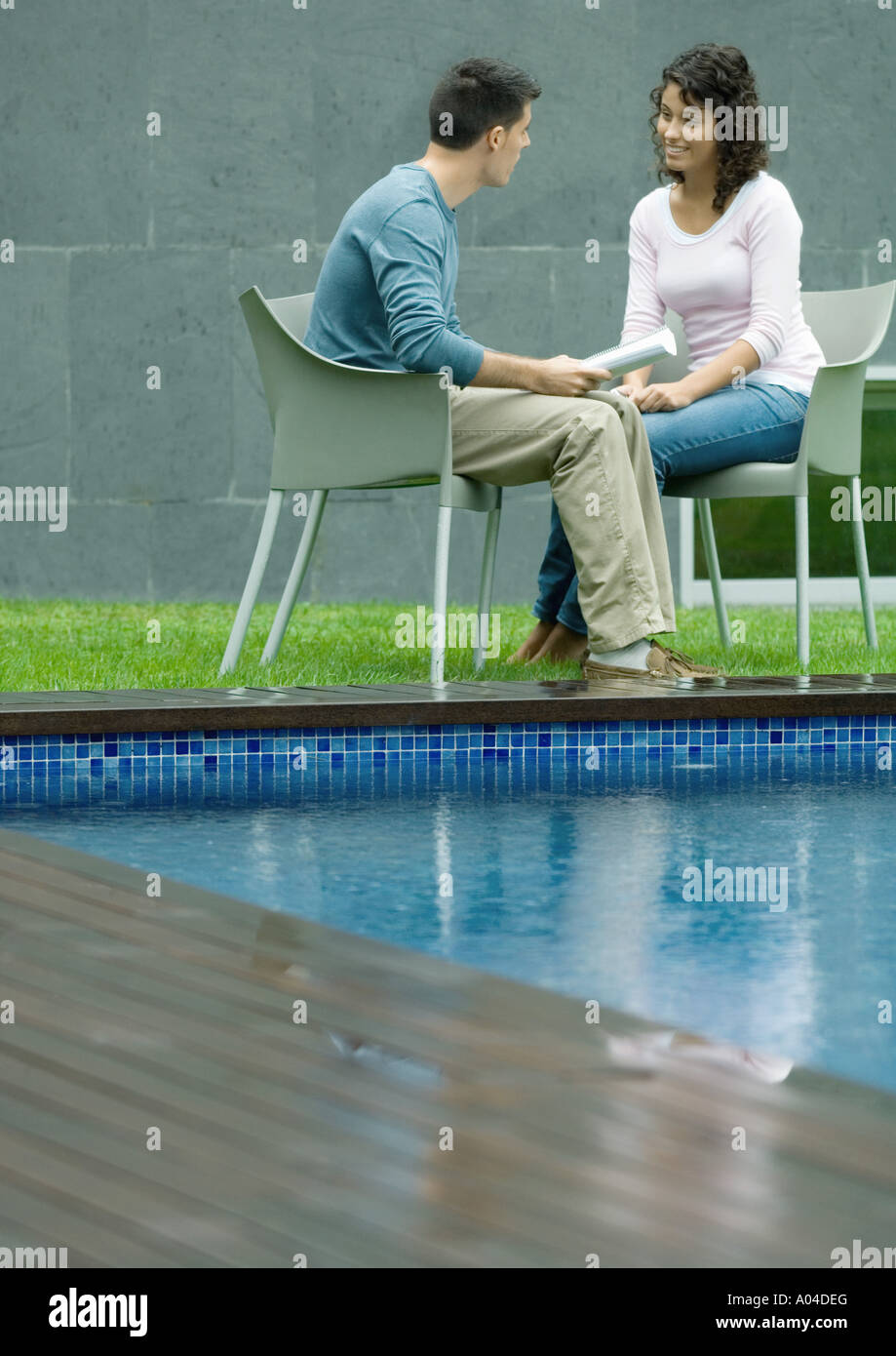 Woman sits edge swimming pool hi-res stock photography and images - Alamy