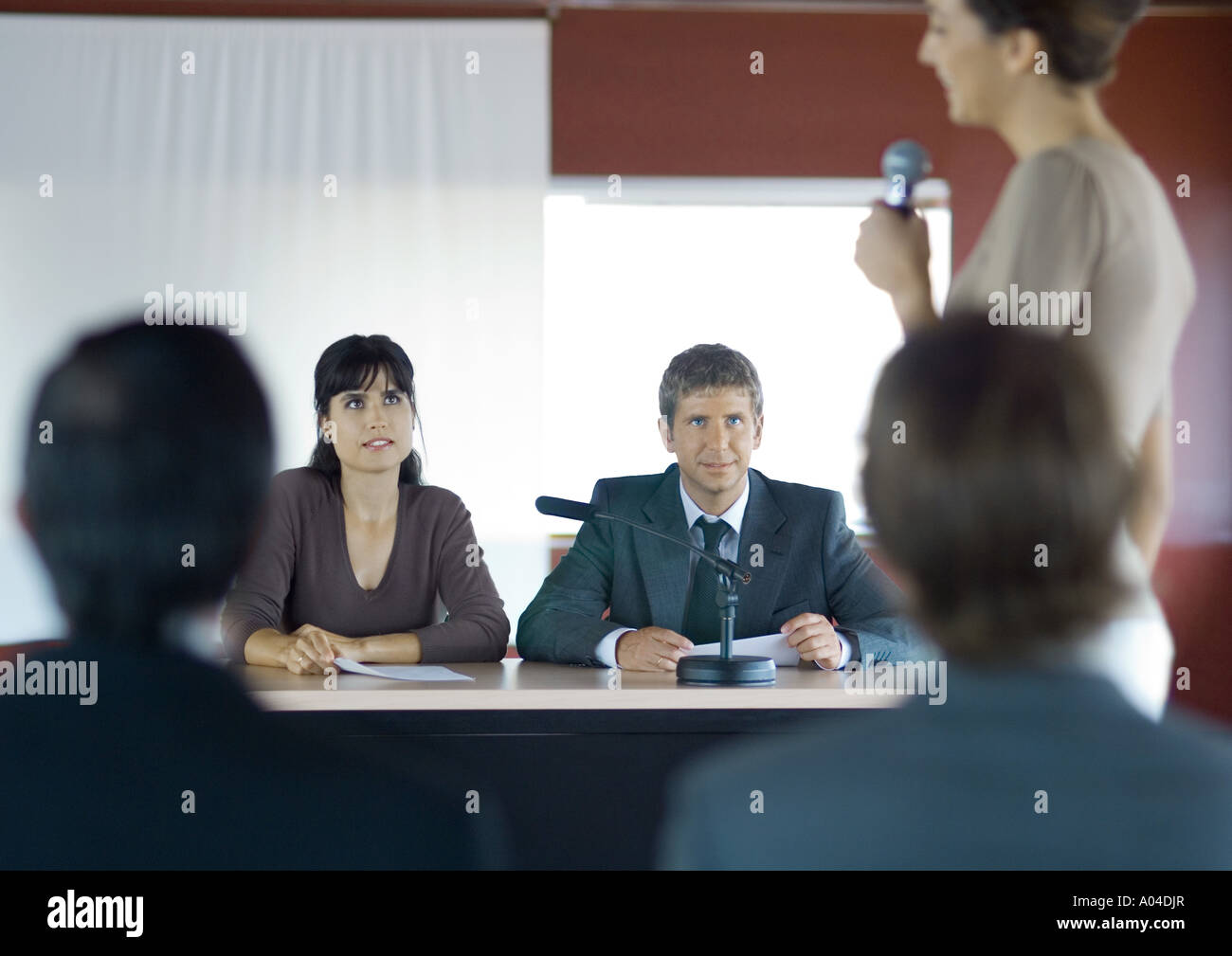 Woman speaking with microphone in conference room during seminar Stock ...