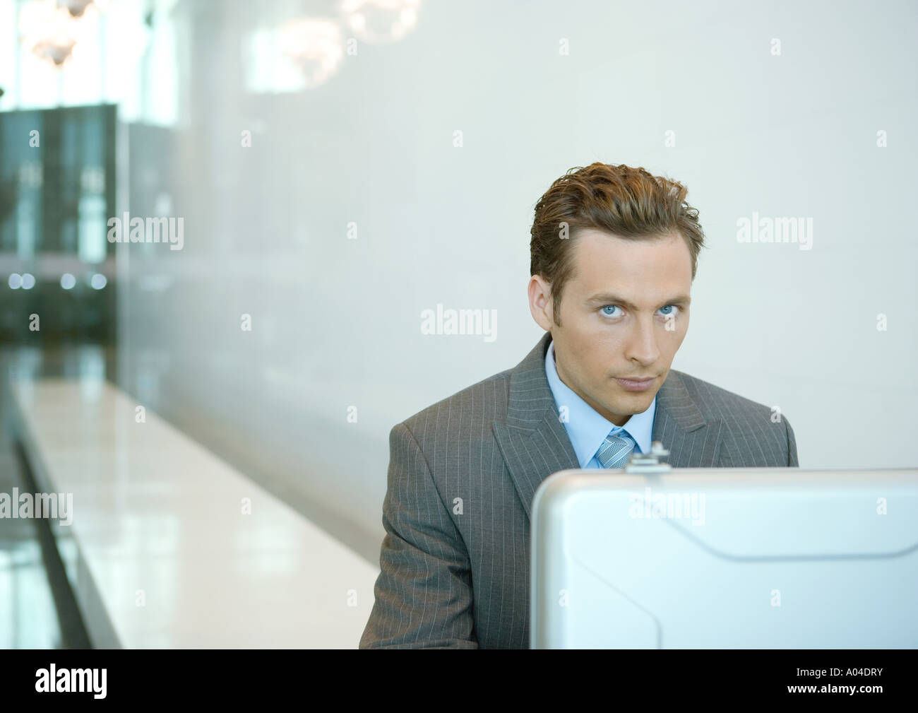 Man sitting with open briefcase Stock Photo - Alamy